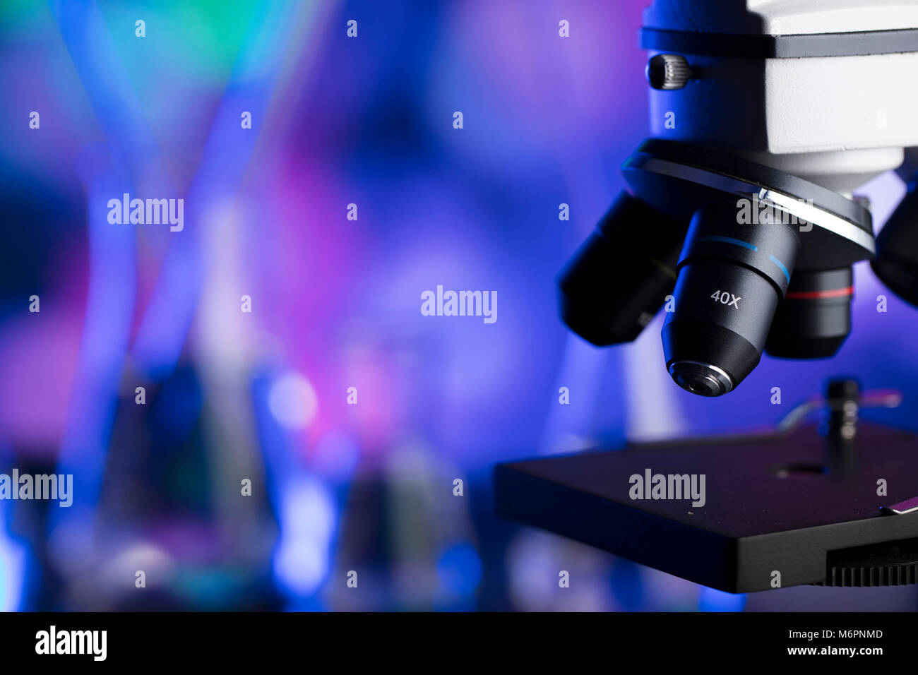 Science concept background. Microscope and laboratory glassware ...