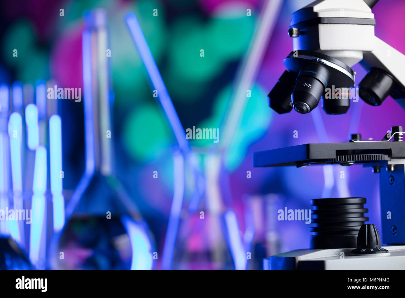 Science concept background. Microscope and laboratory glassware ...