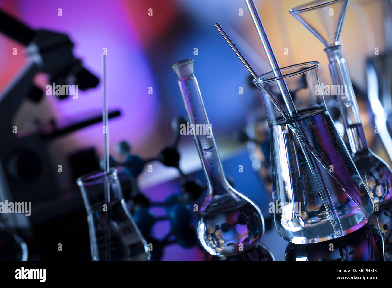 Science concept background. Microscope and laboratory glassware ...