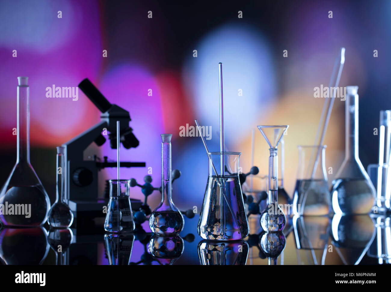 Science concept background. Microscope and laboratory glassware ...