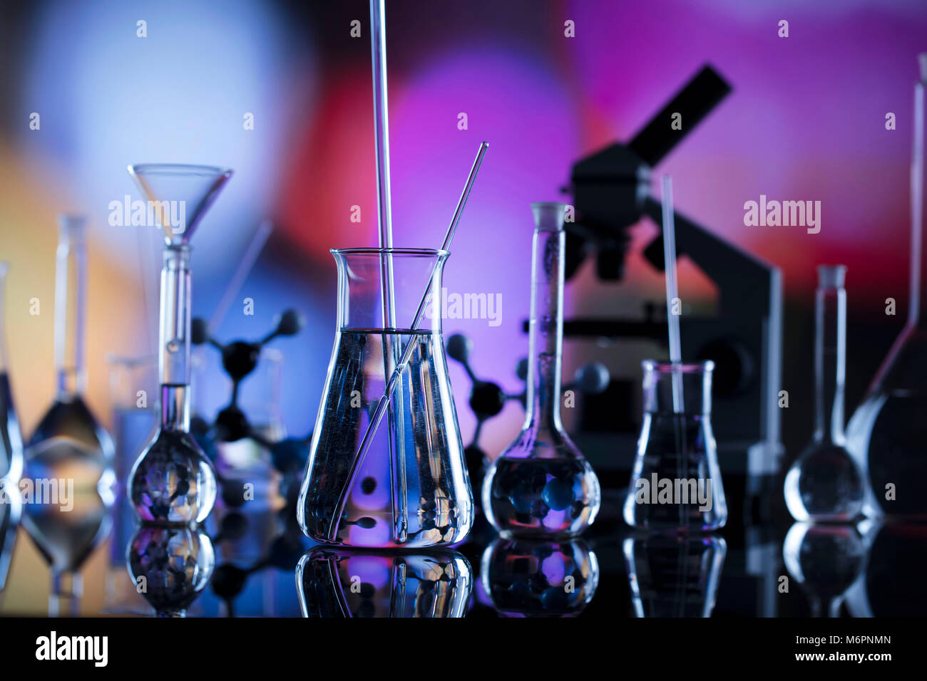 Science concept background. Microscope and laboratory glassware ...