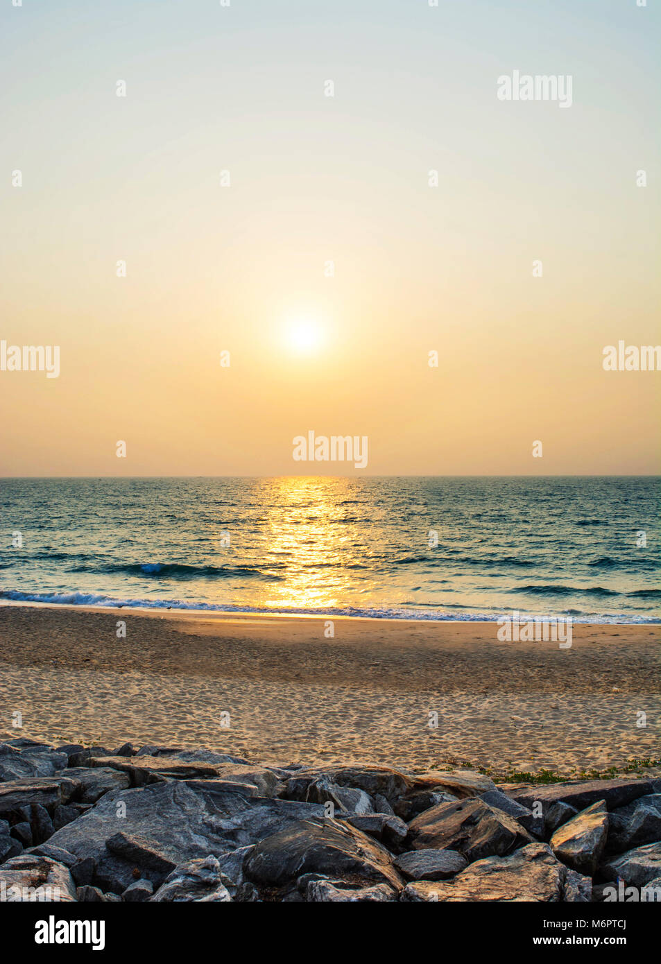 sunset over Beach and tropical sea- India Stock Photo - Alamy