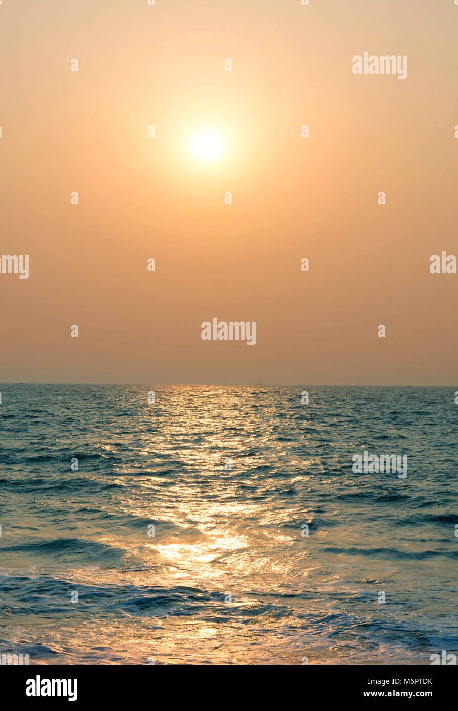 sunset over Beach and tropical sea- India Stock Photo - Alamy