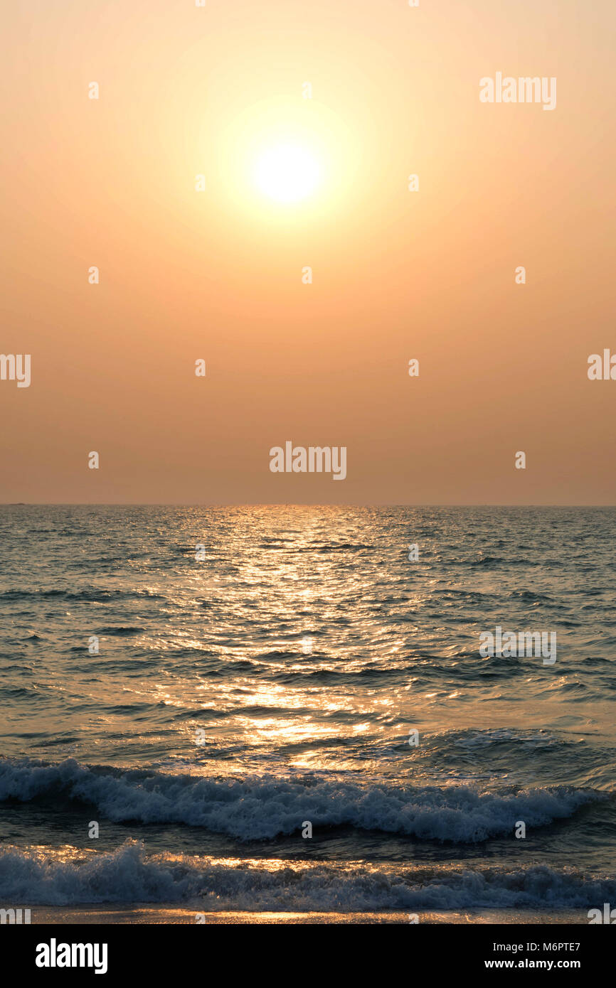 sunset over Beach and tropical sea- India Stock Photo - Alamy
