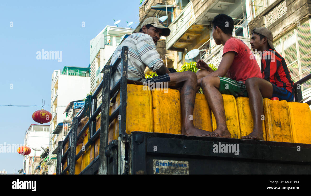 Yangon, Myanmar - February, 15, 2018: workers on yellow truck Stock ...