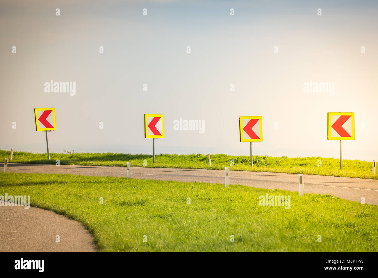 Road signs warning drivers about ahead dangerous curve Stock Photo - Alamy