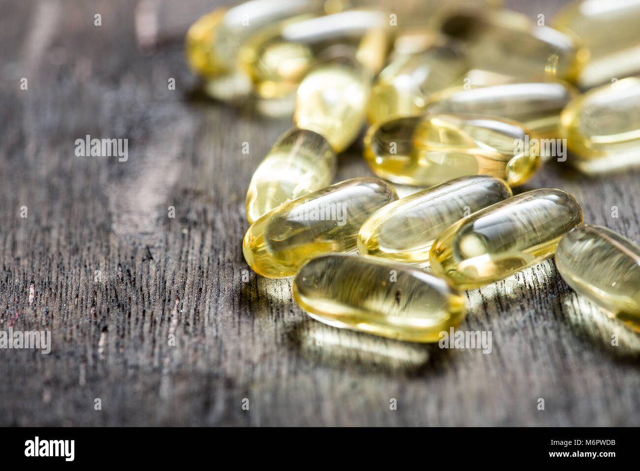 Fish oil capsules with omega 3 and vitamin D. healthy diet concept ...