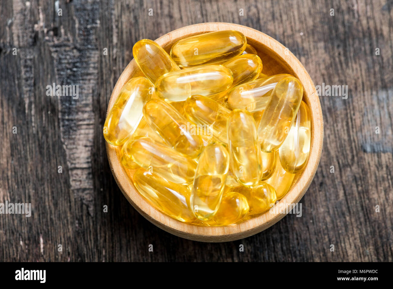 Fish oil capsules with omega 3 and vitamin D. healthy diet concept ...