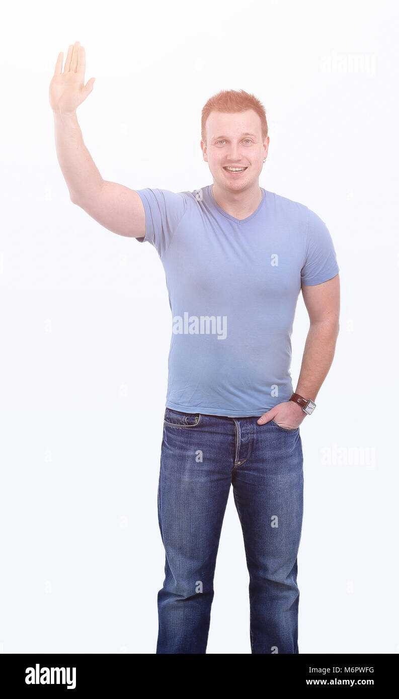 smiling young man raising hand up Stock Photo - Alamy