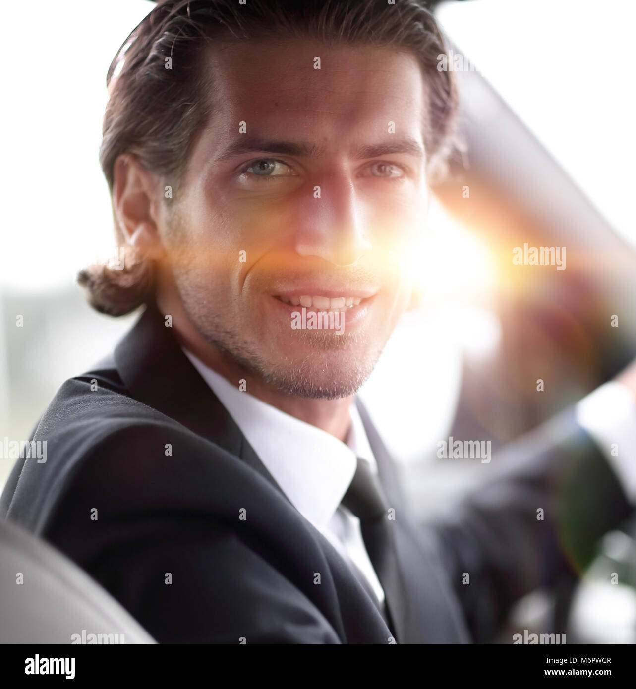 man sitting behind the wheel of a car Stock Photo - Alamy