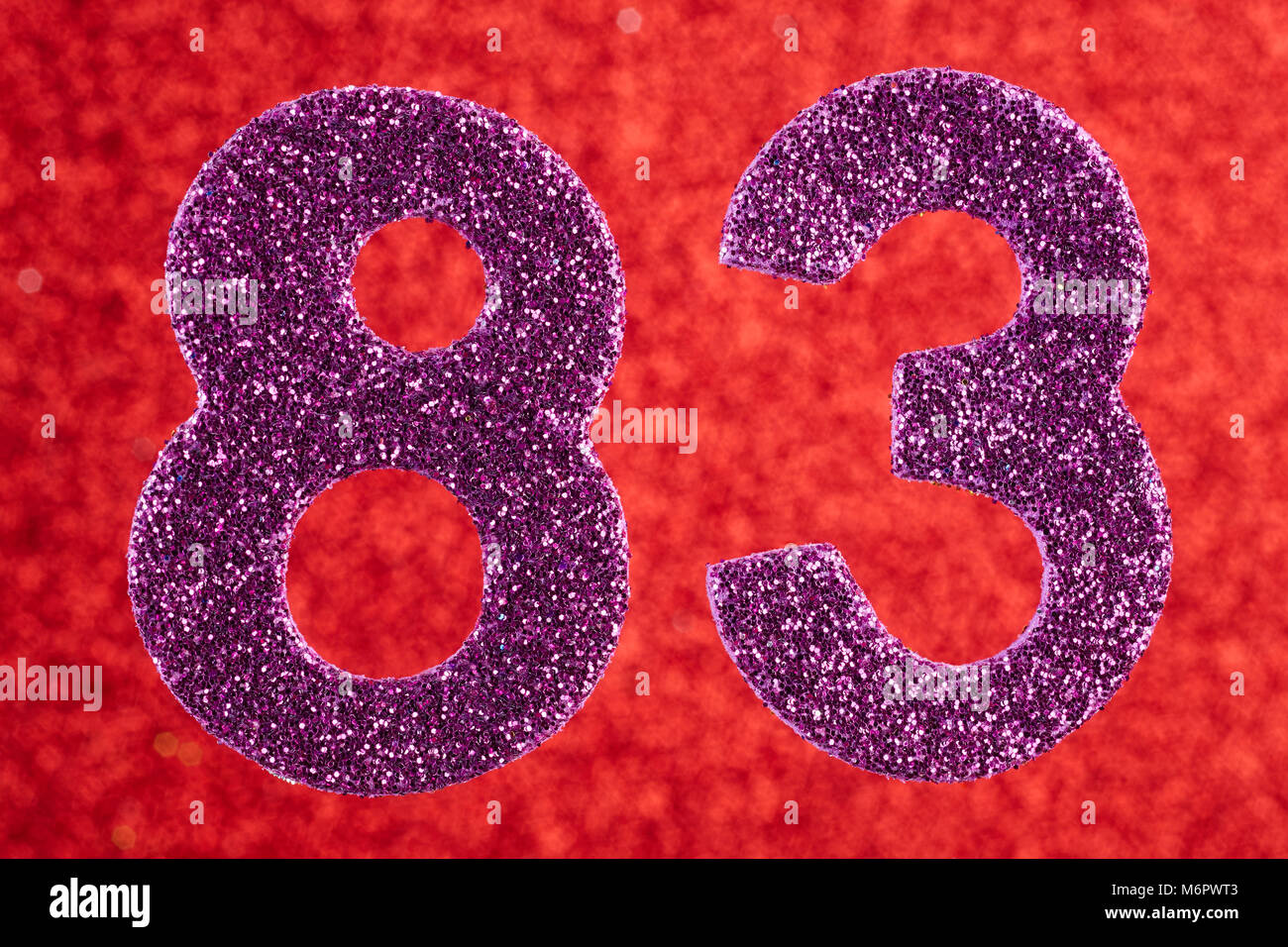 Number eighty-three purple color over a red background. Anniversary ...