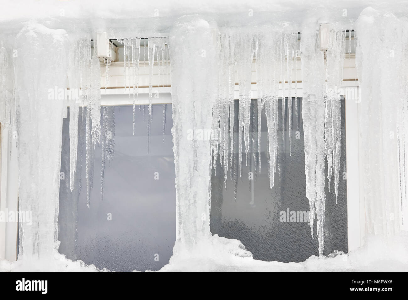 Icicle windows on winter time. Freeze temperatures backgrounds ...