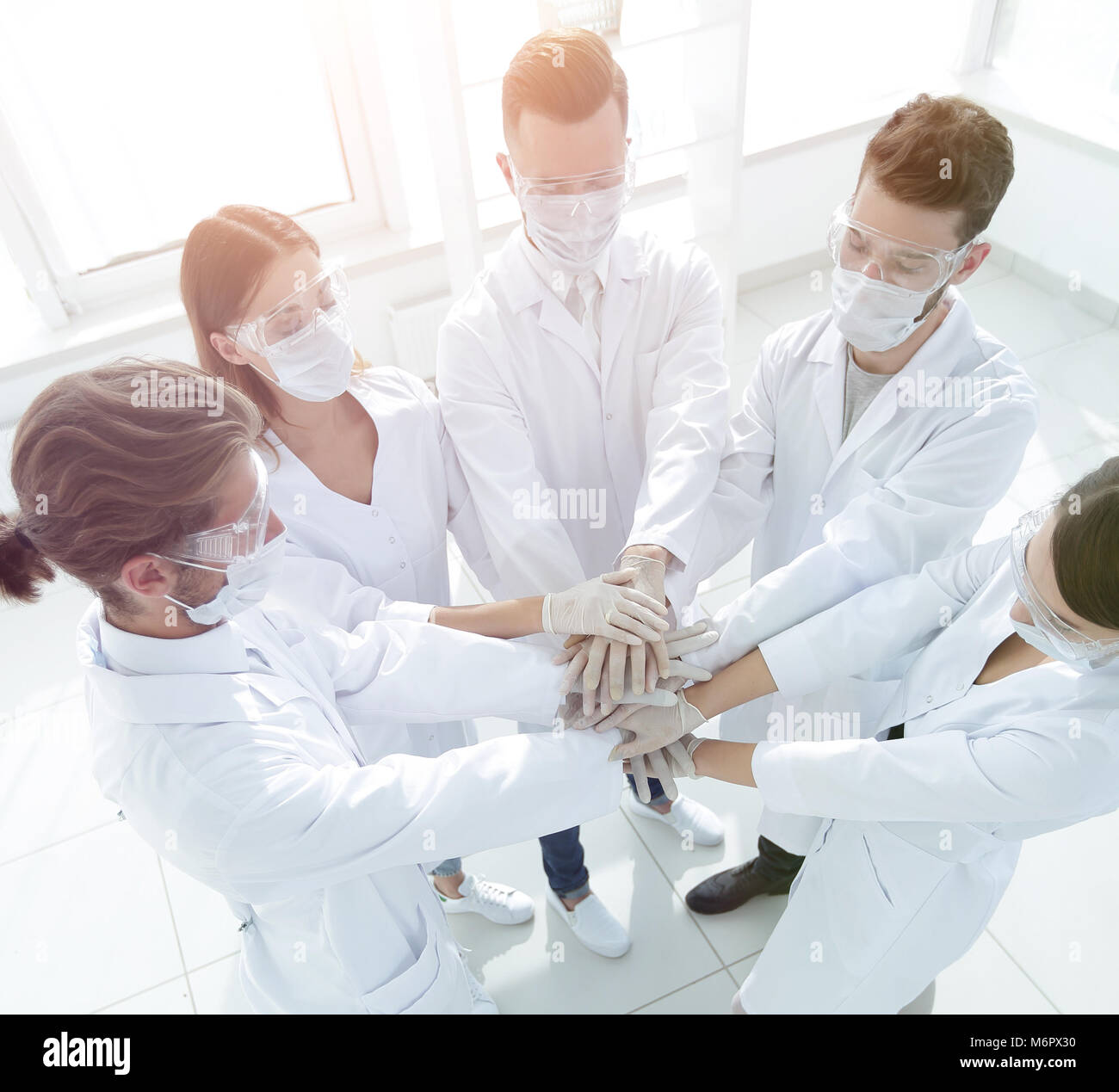 Health care workers demonstrating unity Stock Photo - Alamy