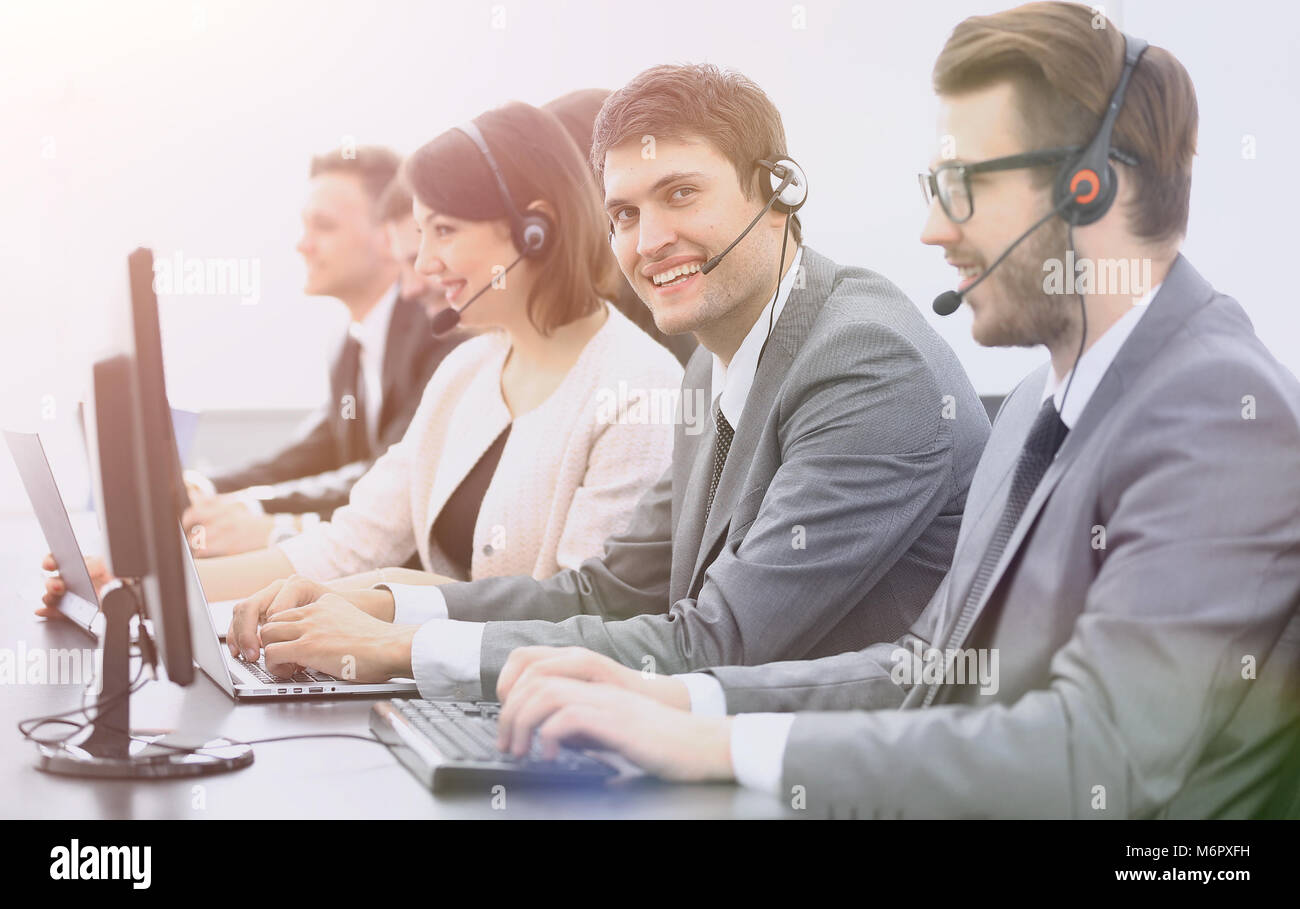 employee call center with headset at workplace Stock Photo - Alamy