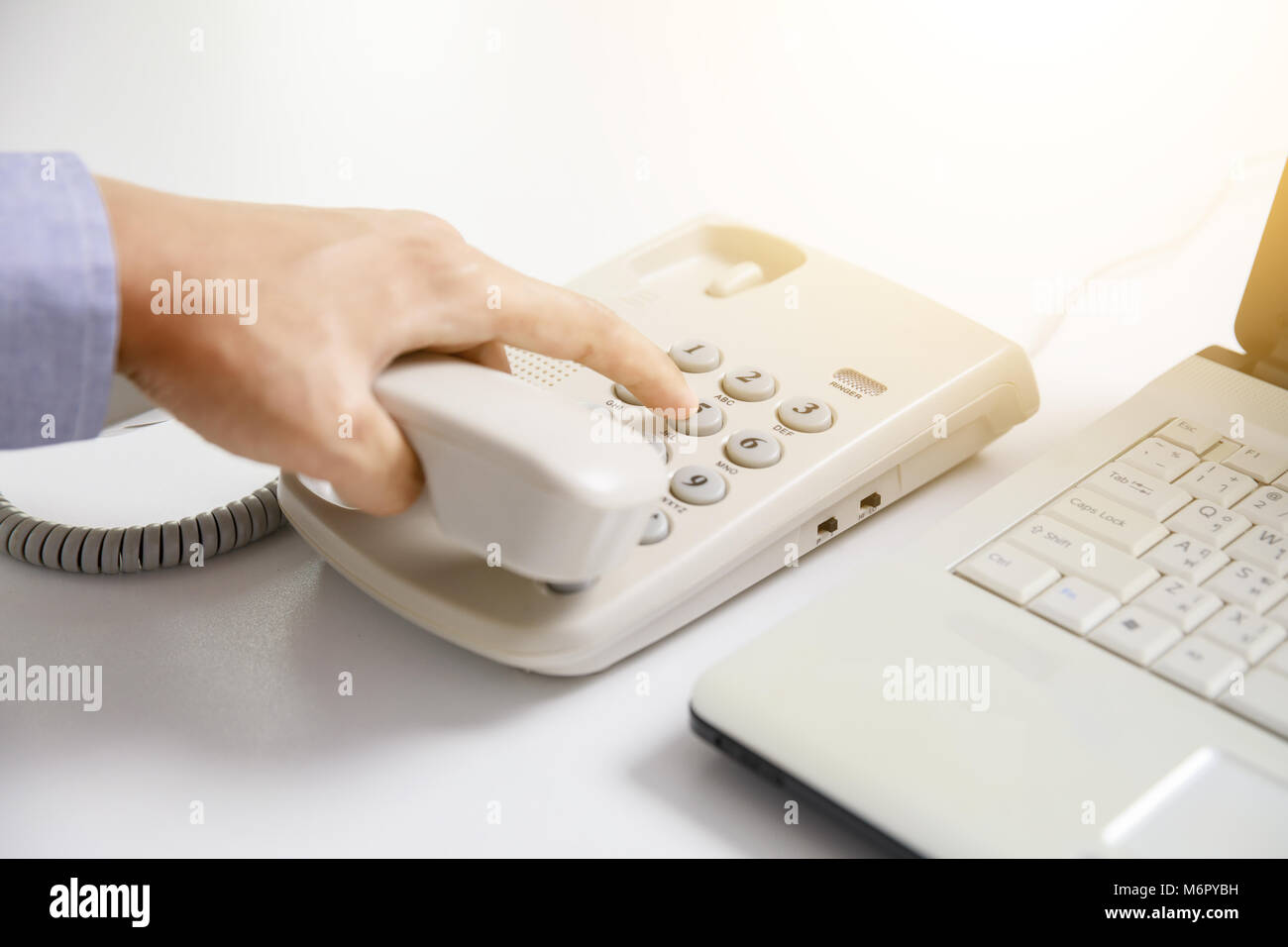 businessman dial digital telephone with office background Stock Photo ...
