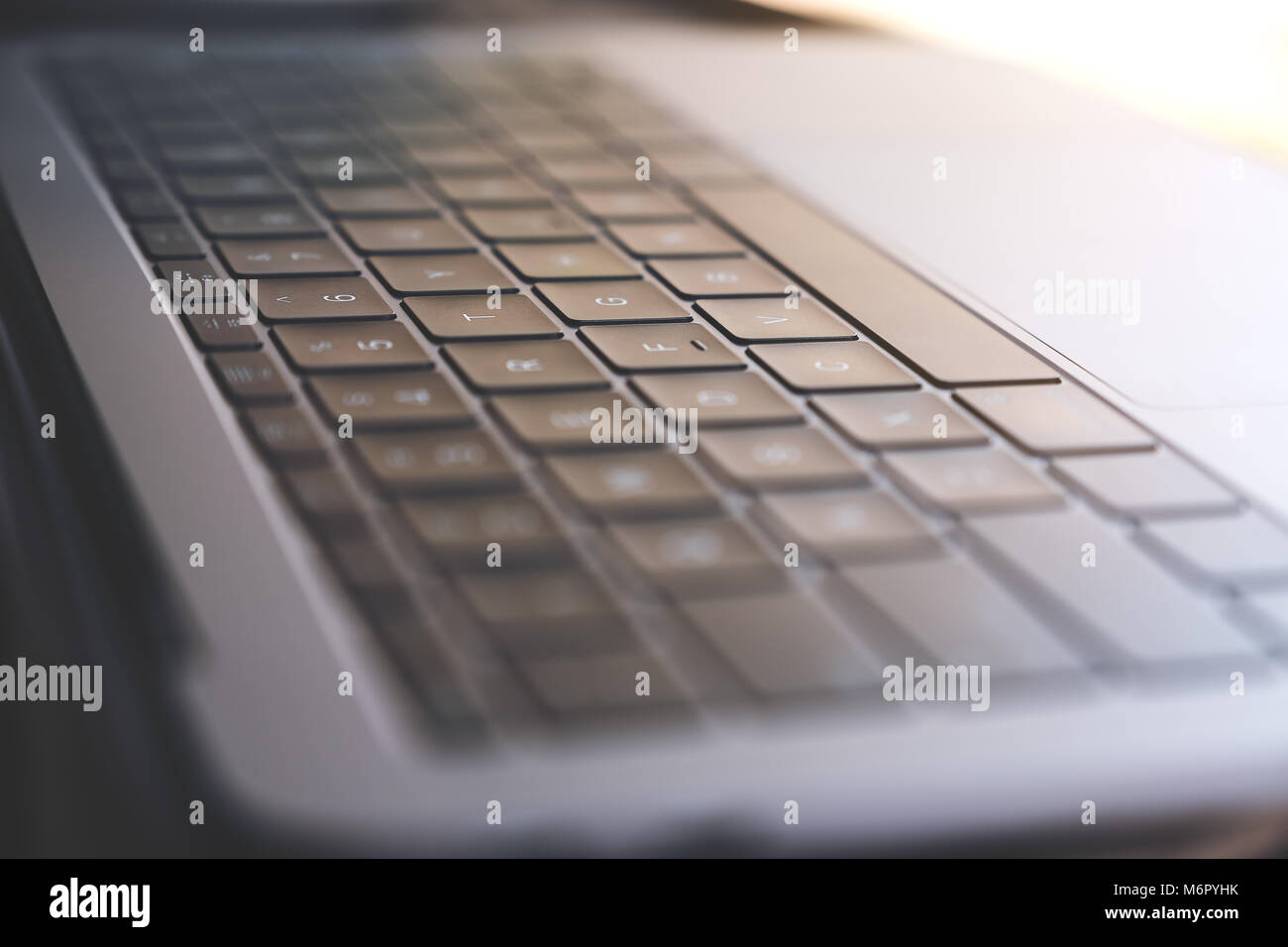 Closeup image of a laptop keyboard with blur background Stock Photo - Alamy