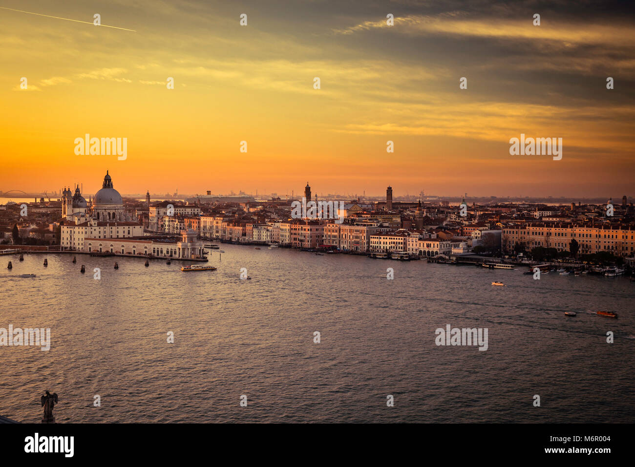 Aerial view of the city of Venice bathed in the winter sunset. View of ...