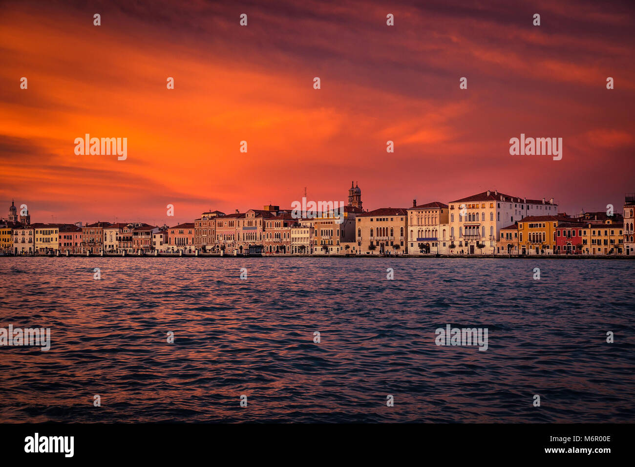 A charming view of Venice's waterfront with palaces and houses in the ...