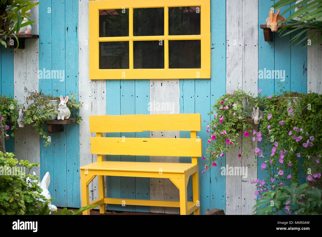 House with window and bench Stock Photo - Alamy