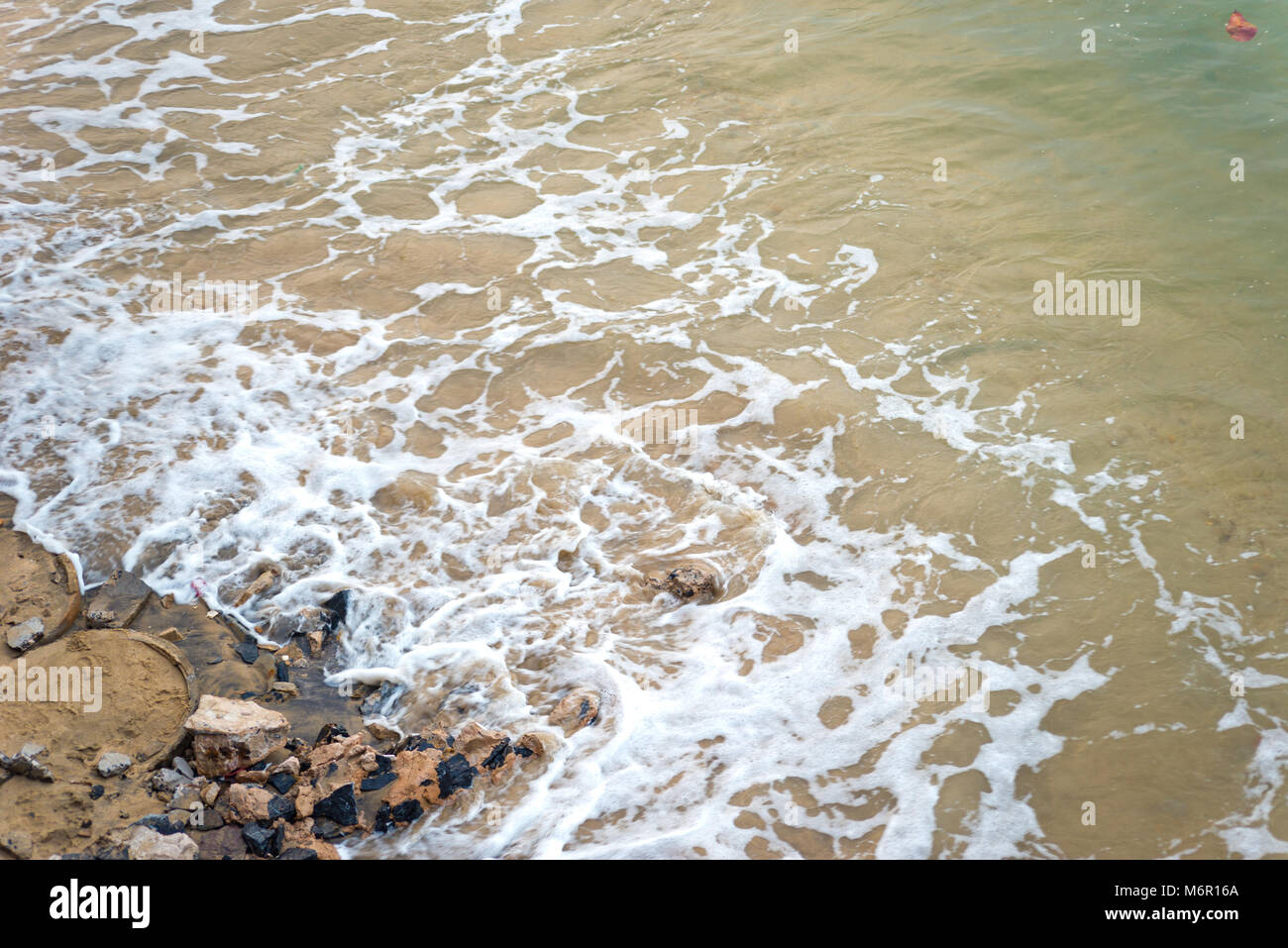 Sea wave and stone beach Stock Photo - Alamy