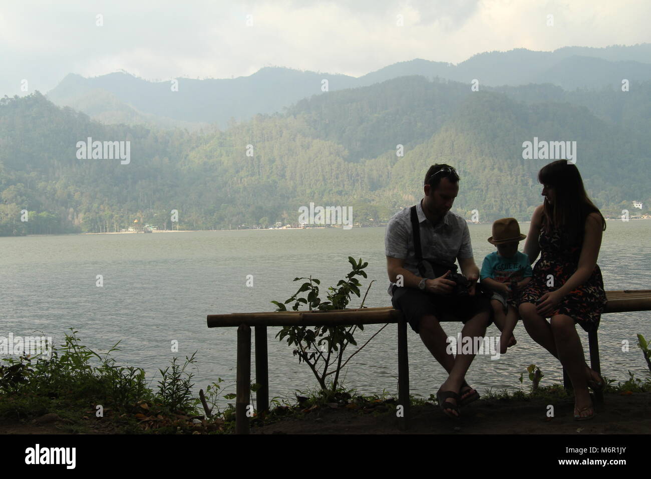 Telaga Ngebel - Western family sitting by a lake in east Java Stock ...