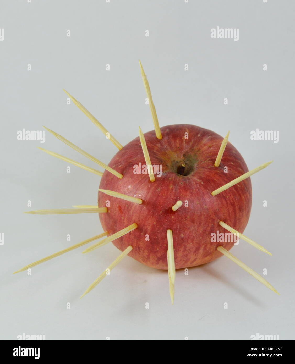 toothpicks stab into red apple Stock Photo - Alamy