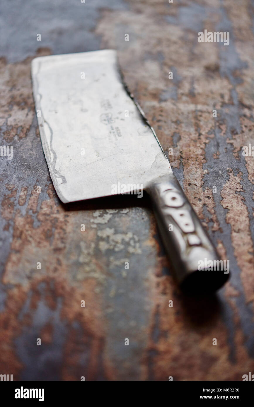 large chef's kitchen knife cleaver vintage in distressed table surface ...
