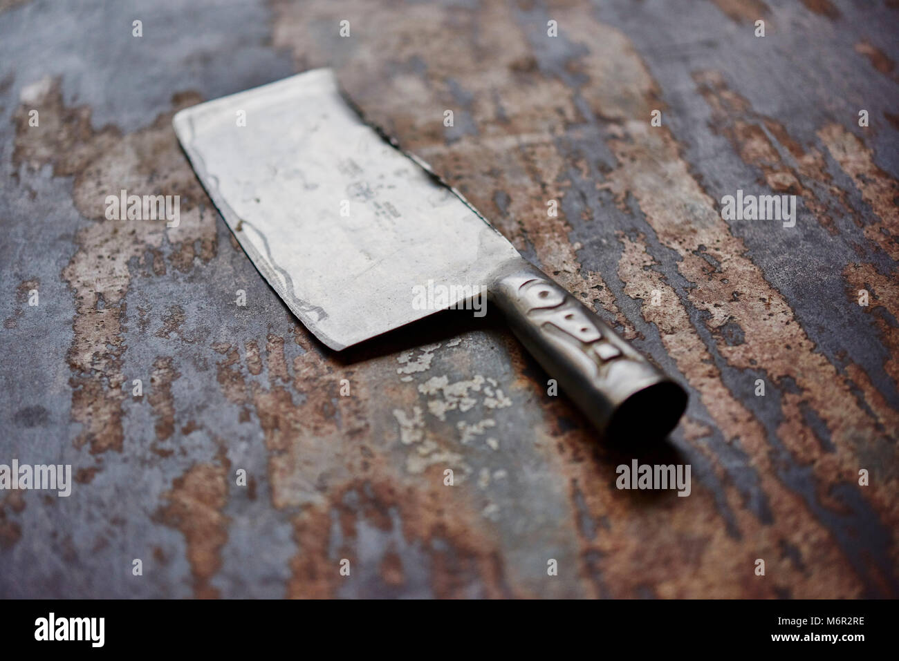 large chef's kitchen knife cleaver vintage in distressed table surface ...