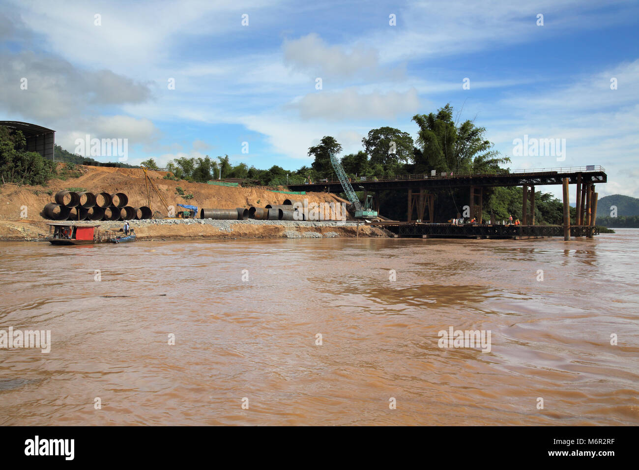 construction of a new bridge on the mekong river flowing through laos ...