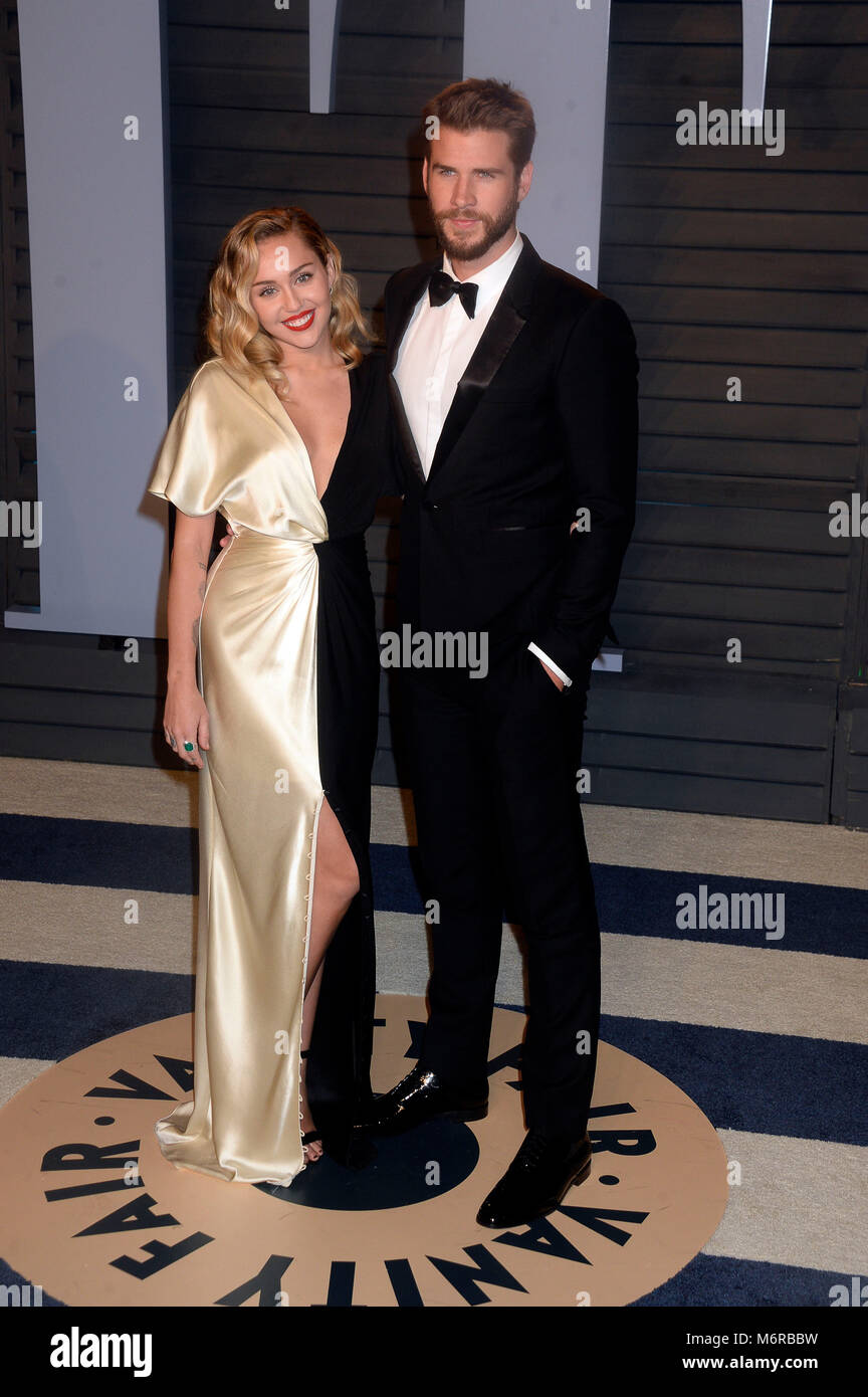 Miley Cyrus and Liam Hemsworth attending the 2018 Vanity Fair Oscar ...