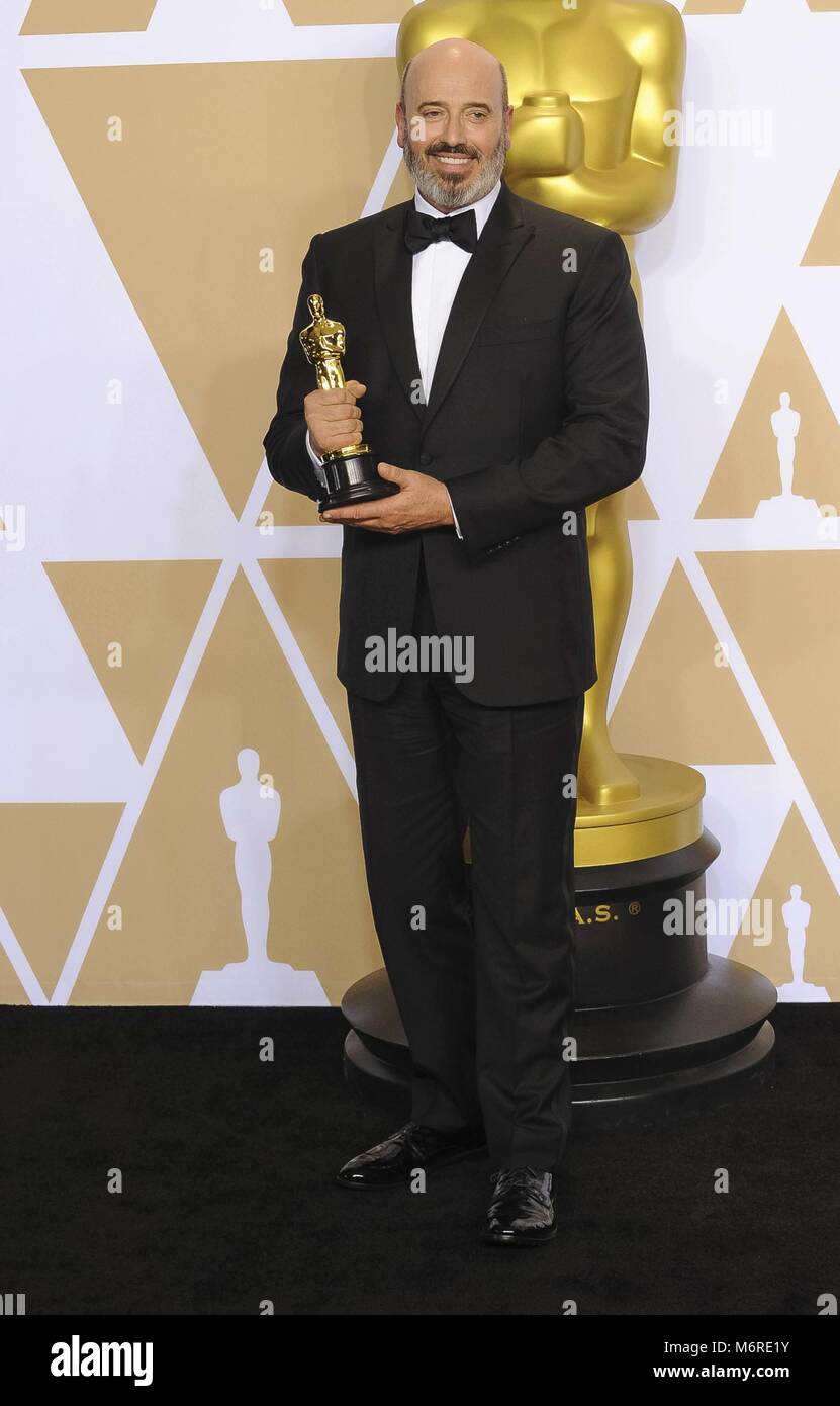 Costume designer Mark Bridges poses in the press room of the 90th ...