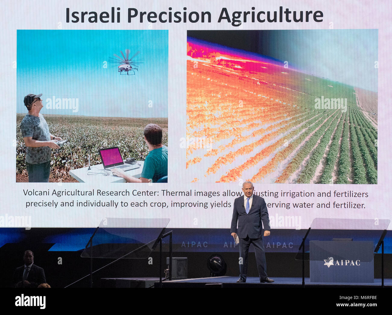 Prime Minister Benjamin Netanyahu of Israel stands in front of a chart ...