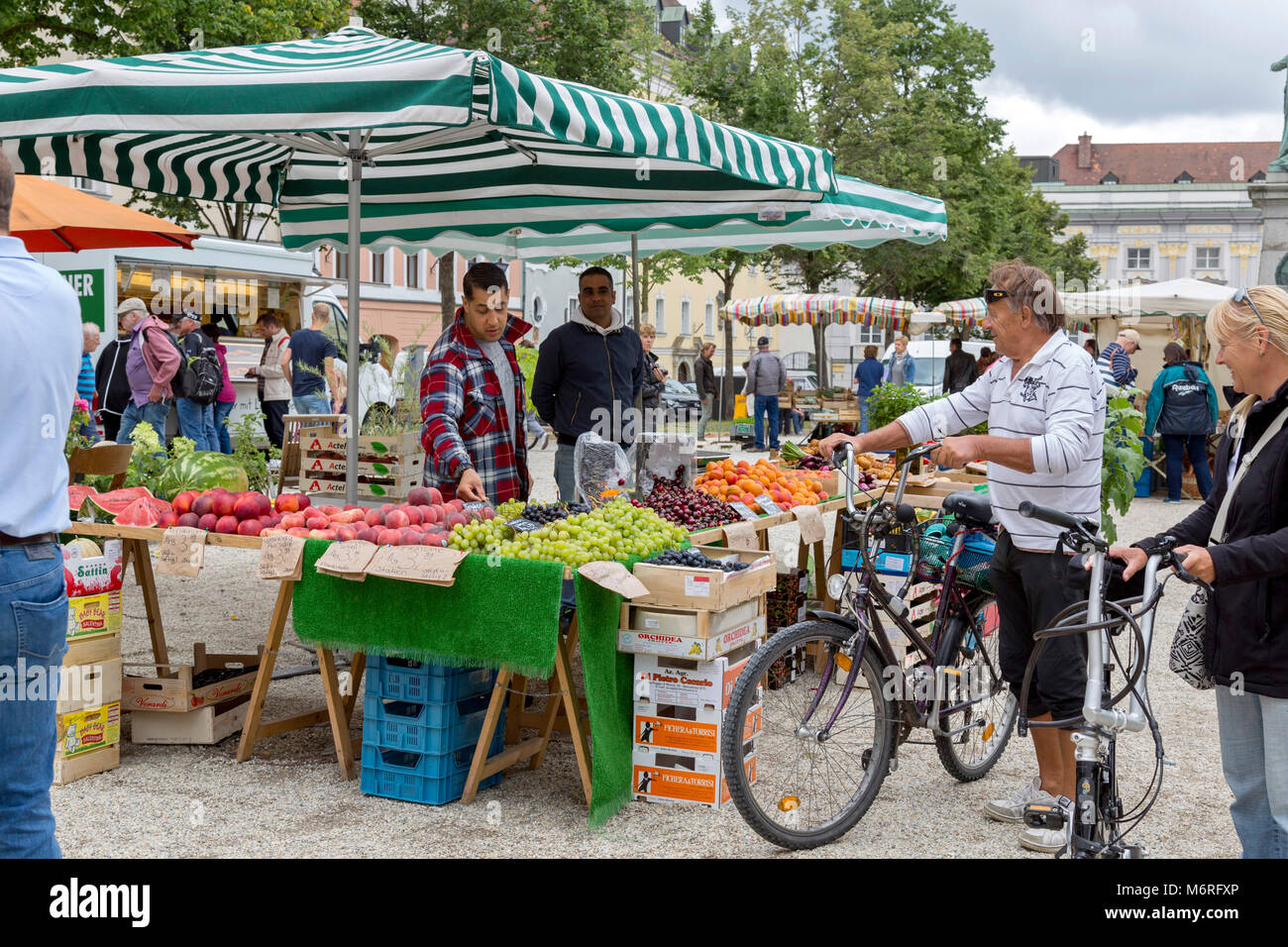 Outdoor market in Passau, Germany. Selling fruit and produce. A couple ...