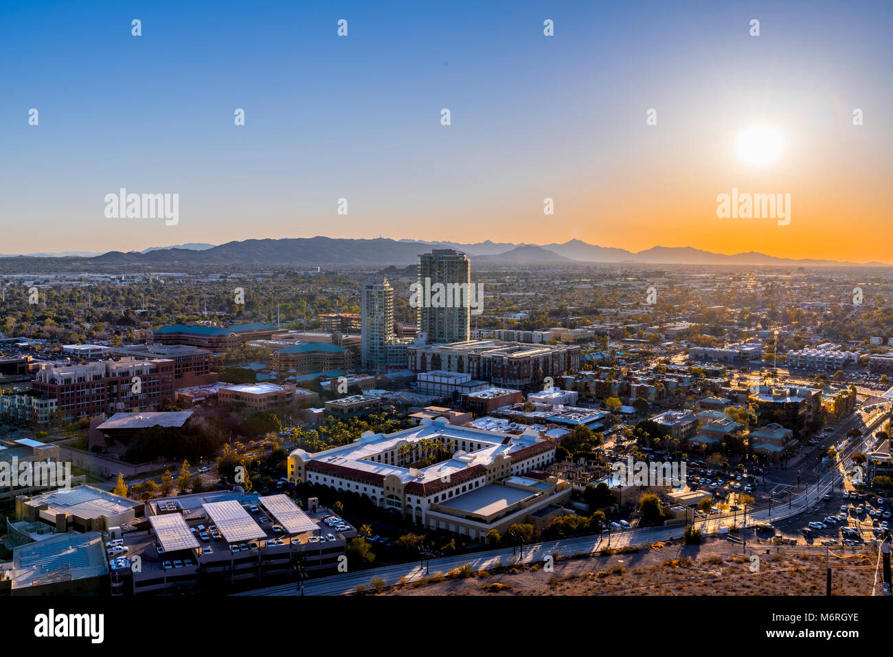 An overlook from atop Mountain Butte of sunset over downtown Phoenix ...