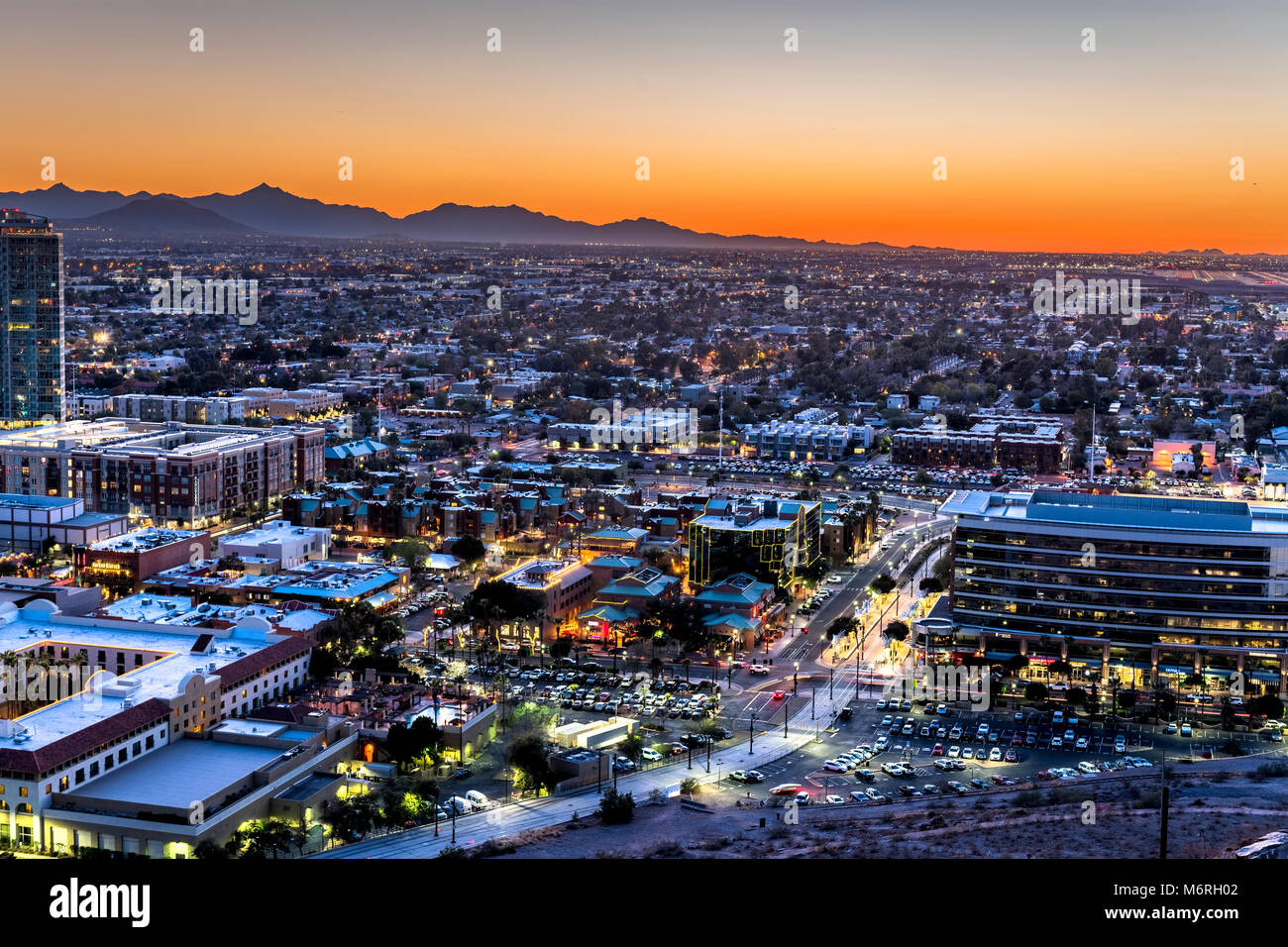 An overlook from atop Mountain Butte of sunset over downtown Phoenix ...