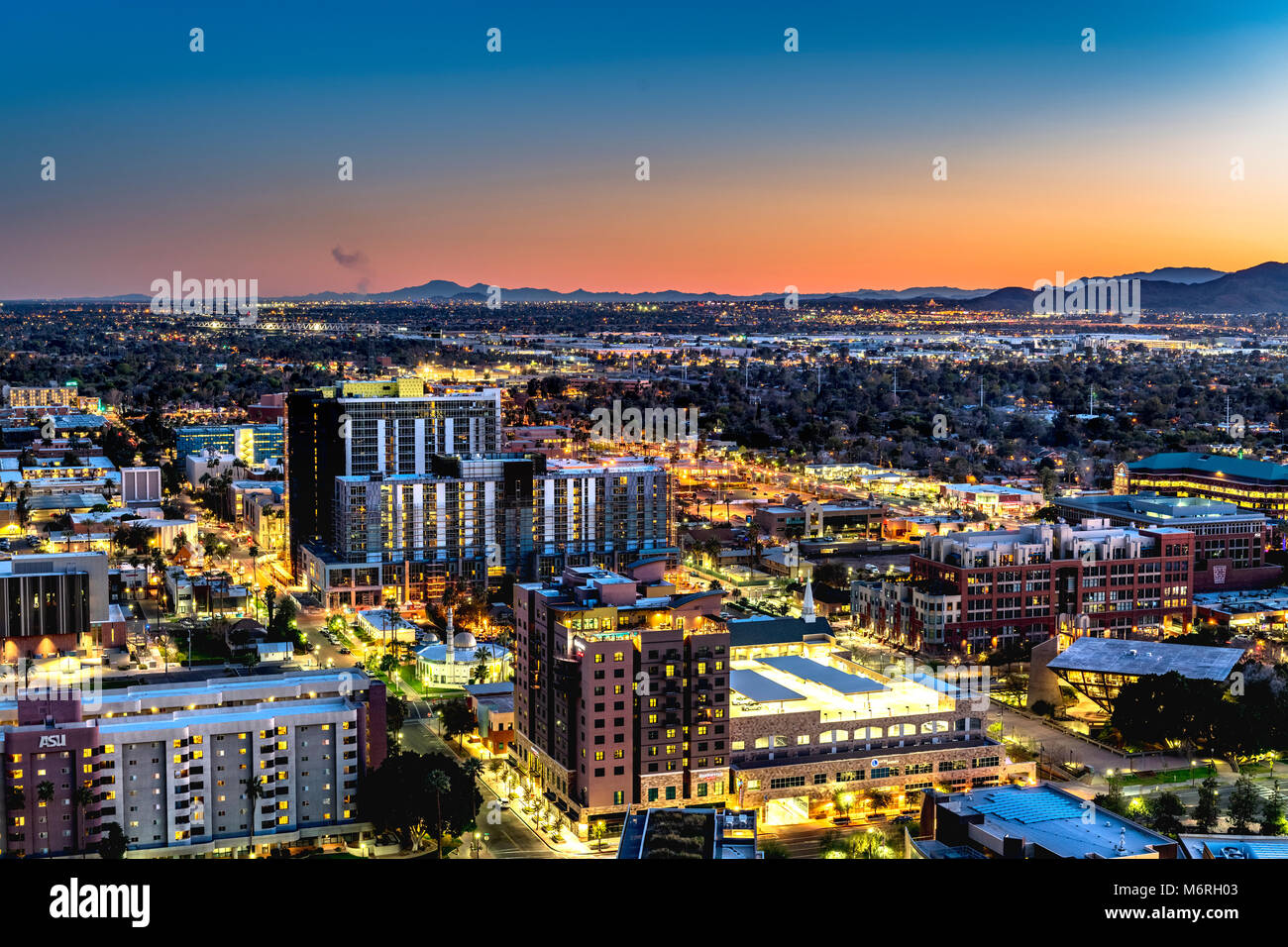 An overlook from atop Mountain Butte of sunset over downtown Phoenix ...
