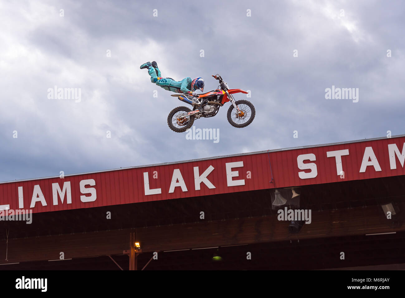 Man performs a freestyle motocross stunt in mid-air at the 90th ...