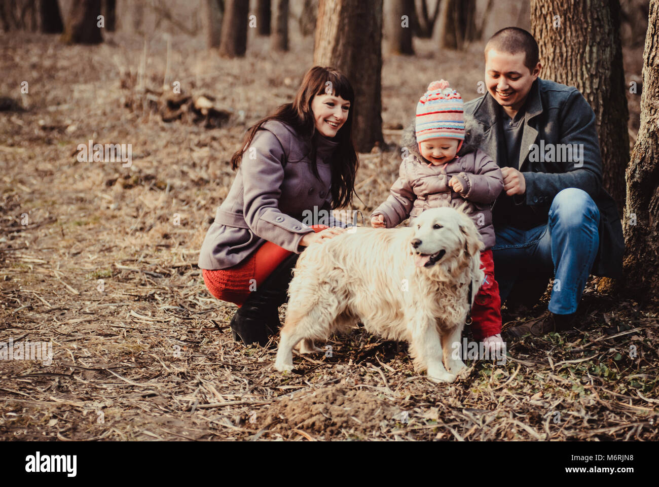 Family with dog Stock Photo - Alamy