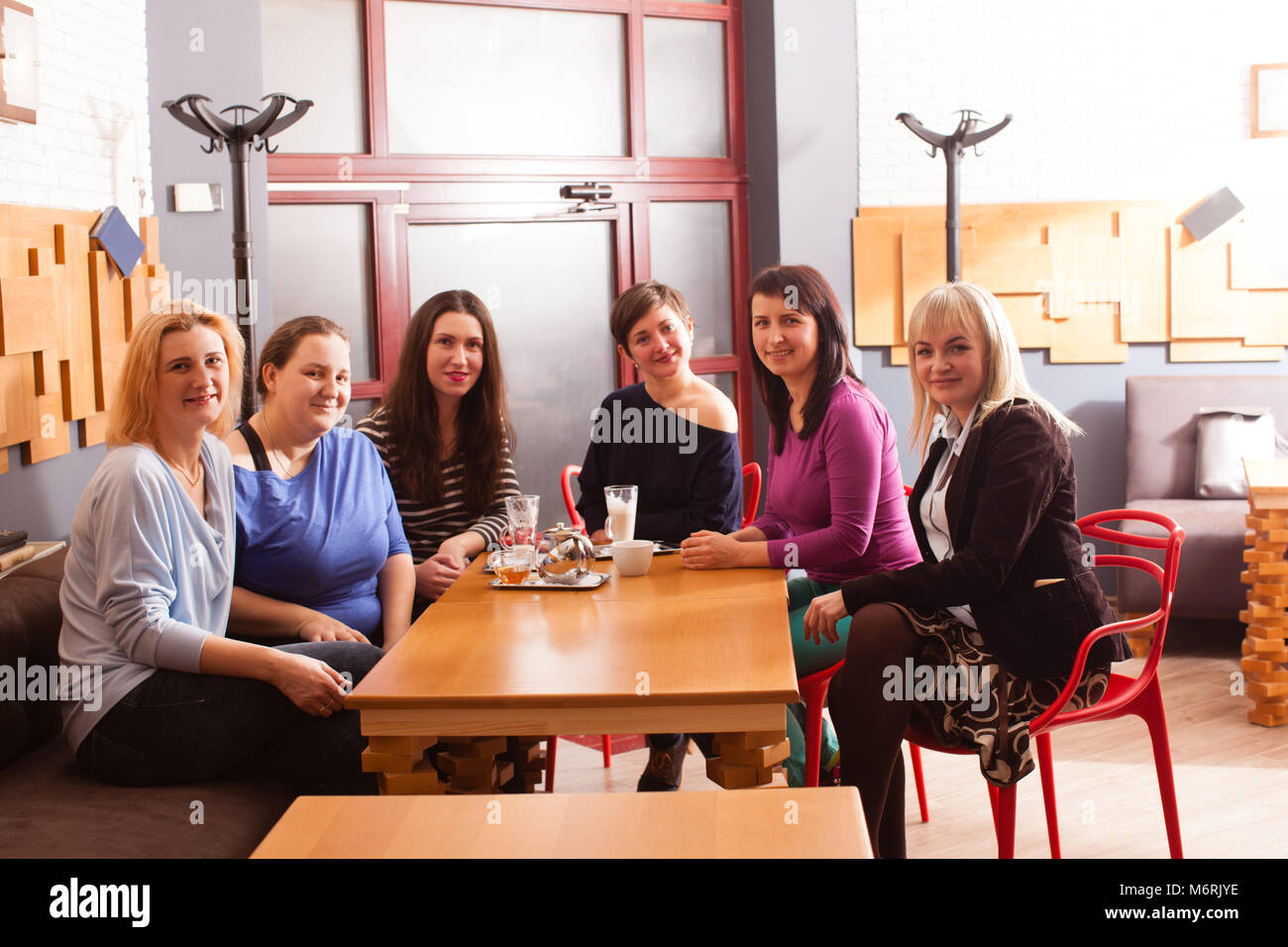 Informal meeting friends in cafe Stock Photo - Alamy