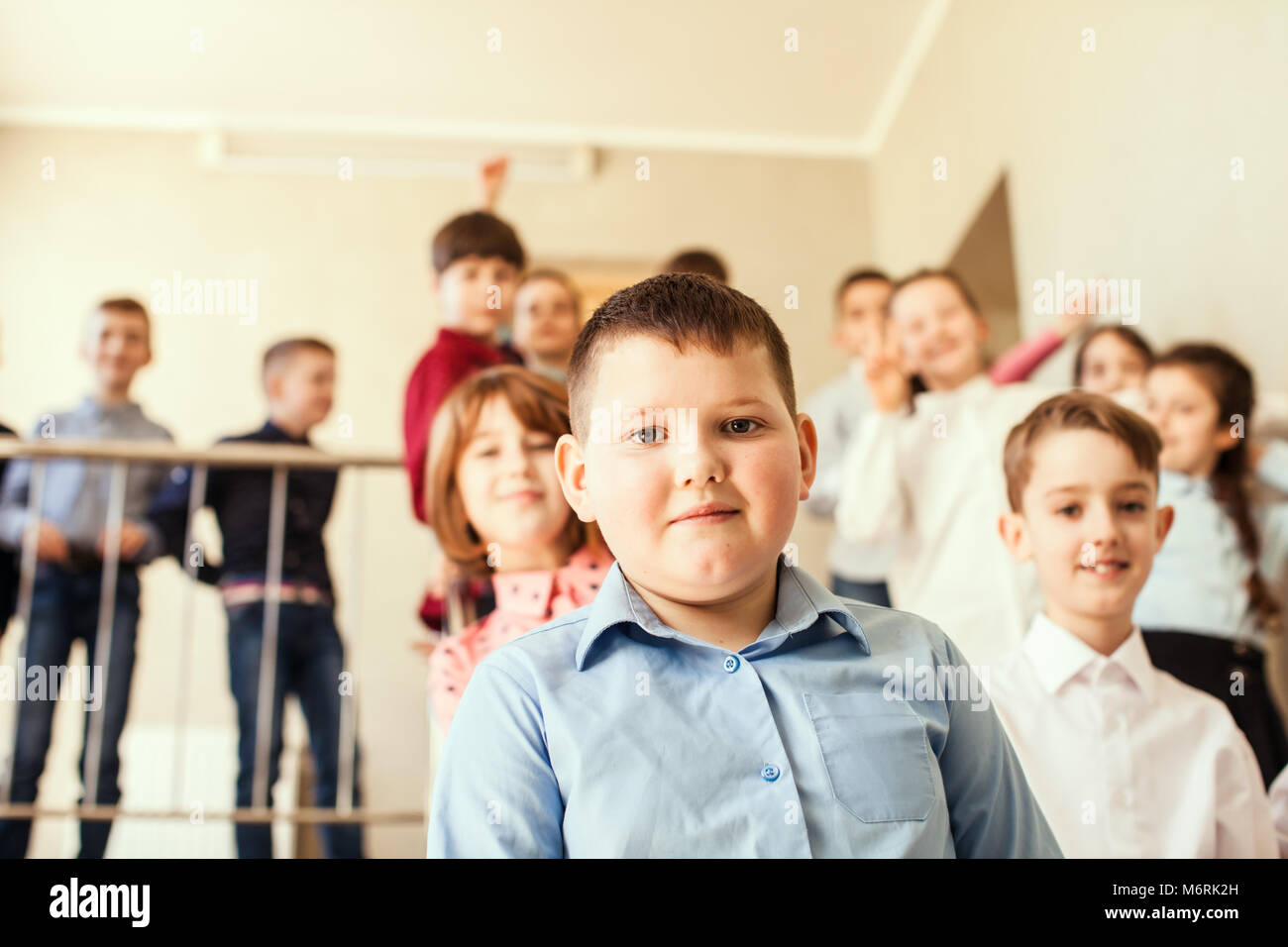 Pupils standing on the stairs Stock Photo - Alamy