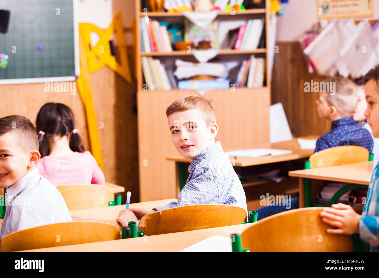 Boy write in the copybook Stock Photo - Alamy