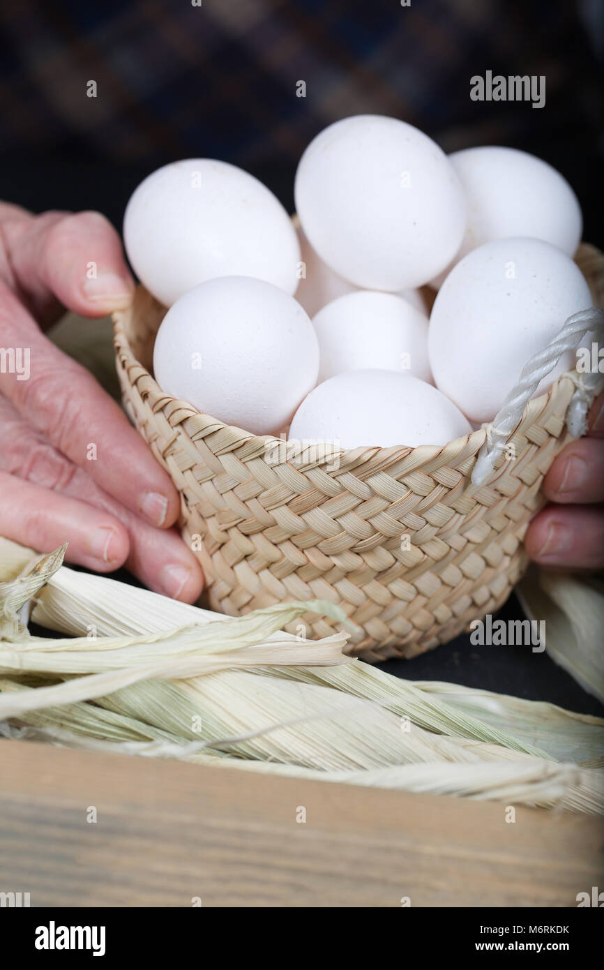Old woman and fresh chicken eggs.Closeup Stock Photo - Alamy