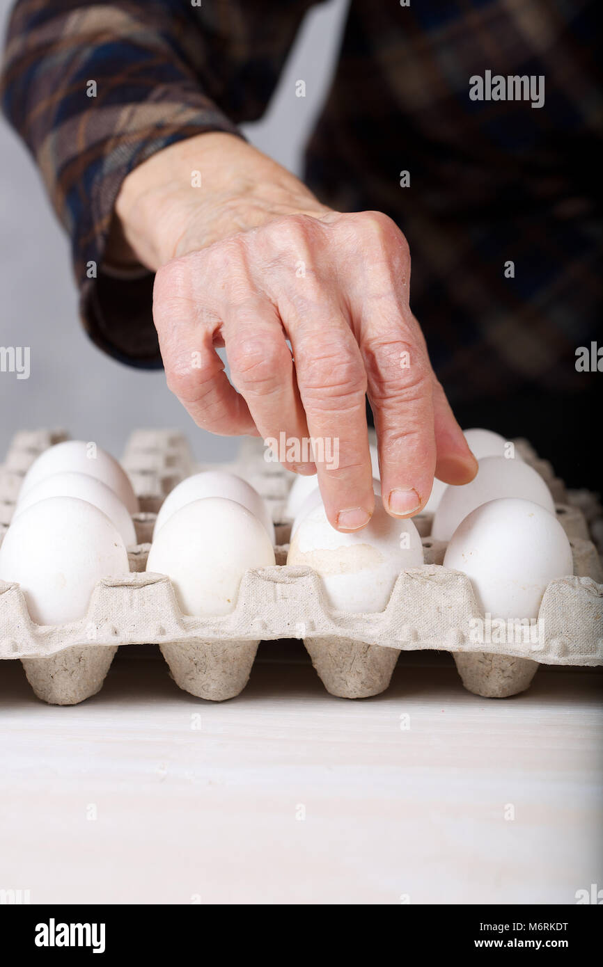 Old woman and fresh chicken eggs.Closeup Stock Photo - Alamy