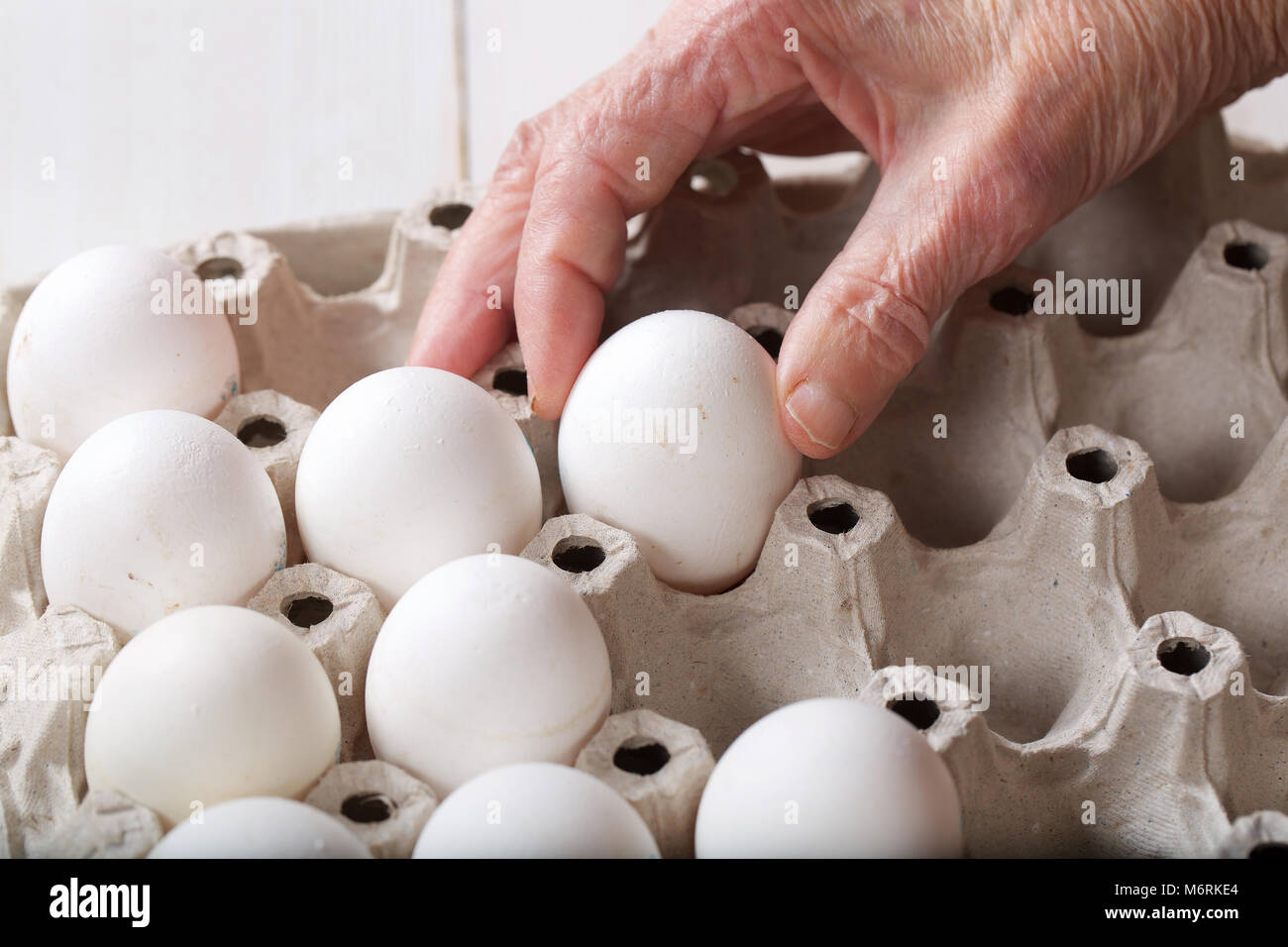 Old woman and fresh chicken eggs.Closeup Stock Photo - Alamy