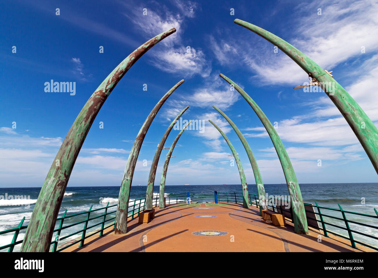 Close up view curves, paved pattern and texture on empty Whalebone pier ...
