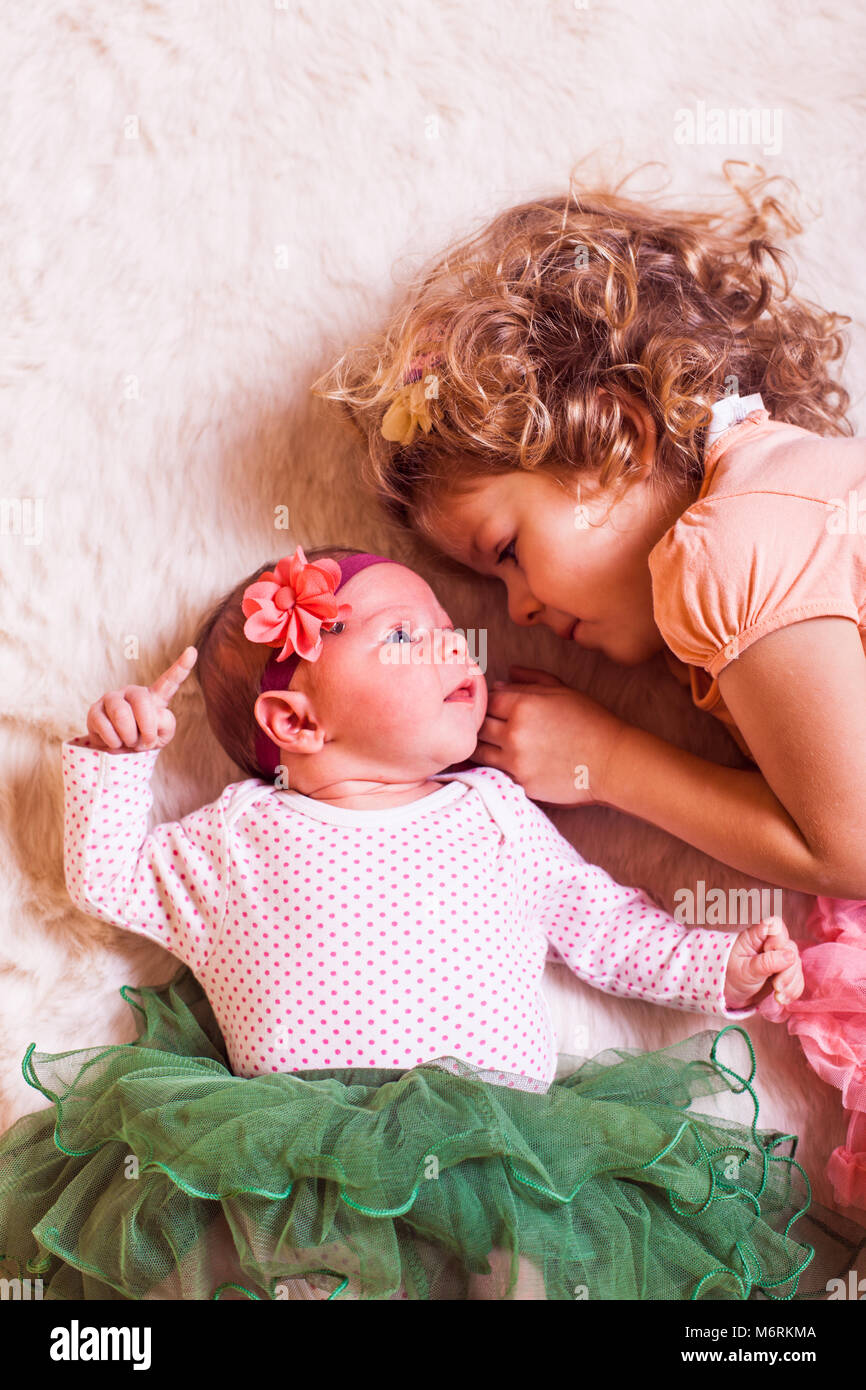 Two sisters play Stock Photo - Alamy