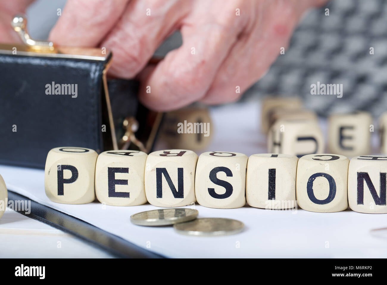 Word pension is composed of small wooden dices Stock Photo - Alamy