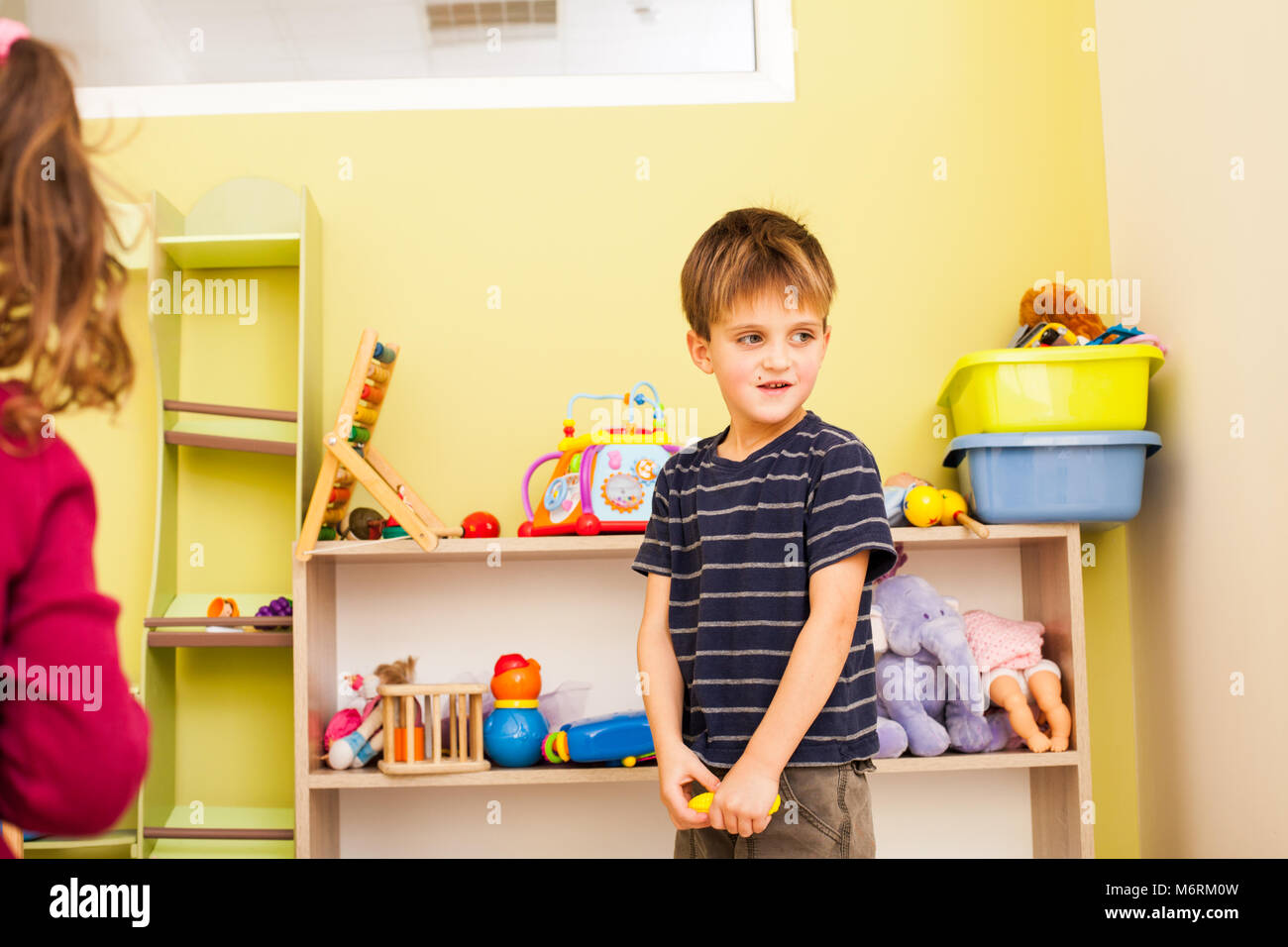 Tidy up own toys Stock Photo - Alamy