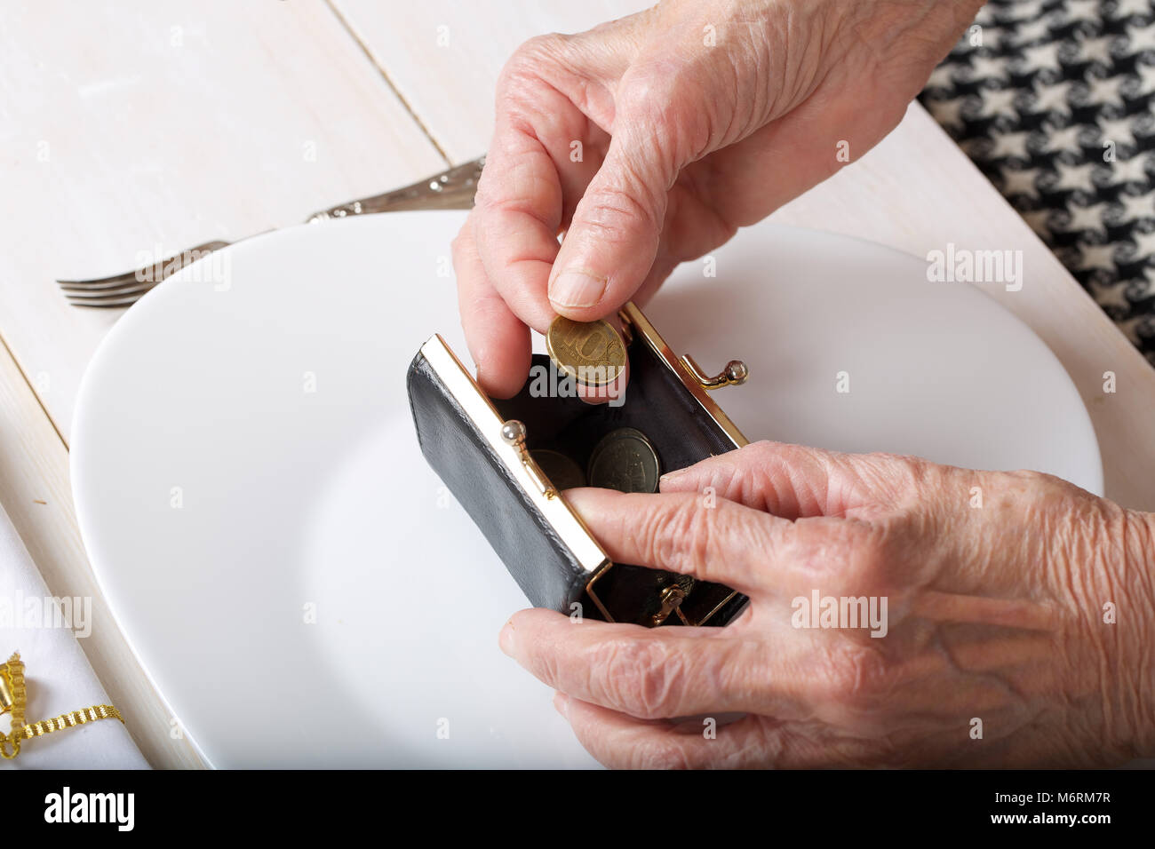 Old woman shows her wallet with coins Stock Photo - Alamy