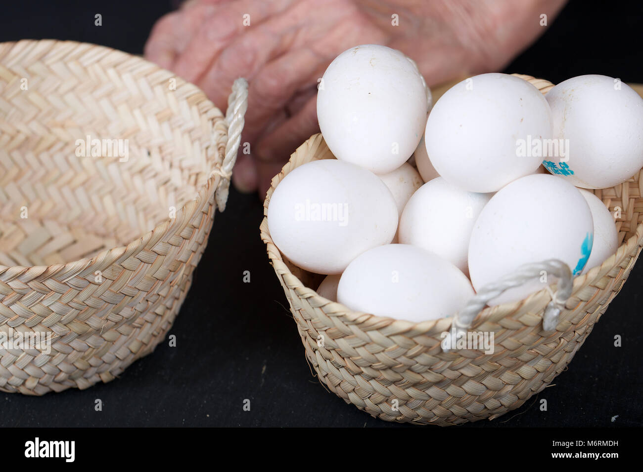 Old woman and fresh chicken eggs.Closeup Stock Photo - Alamy